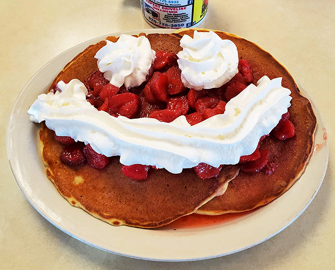 Strawberry pancakes that make you question why anyone would ever skip breakfast &ndash; topped with clouds of whipped cream.