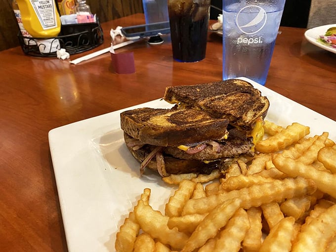 Meet the patty melt that'll melt your heart! Juicy beef, gooey cheese, and grilled onions nestled between perfectly toasted rye.
