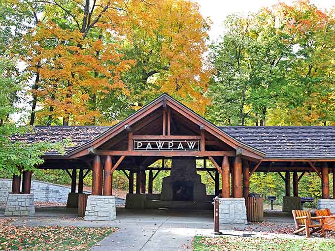 Rustic wooden pavilion welcomes weary hikers, its timber frame and stone pillars echoing the architectural heritage of the park.