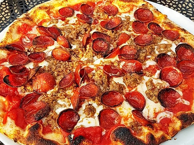 The perfect marriage of crispy-edged pepperoni and house-made sausage creates little pools of flavor that'll haunt your dreams.