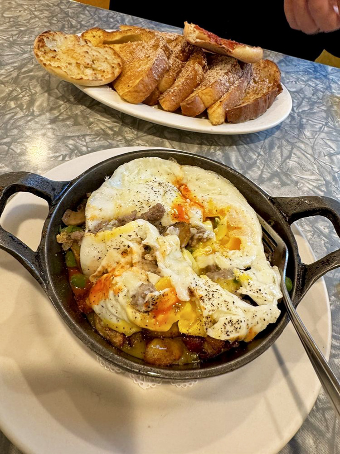 The legendary Philly Skillet arrives sizzling hot, with tender steak and vegetables beneath a blanket of melted cheese and perfectly cooked eggs.