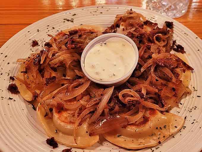 These golden-brown pierogies topped with caramelized onions aren't just dumplings&mdash;they're little pockets of happiness that would make Warsaw proud.