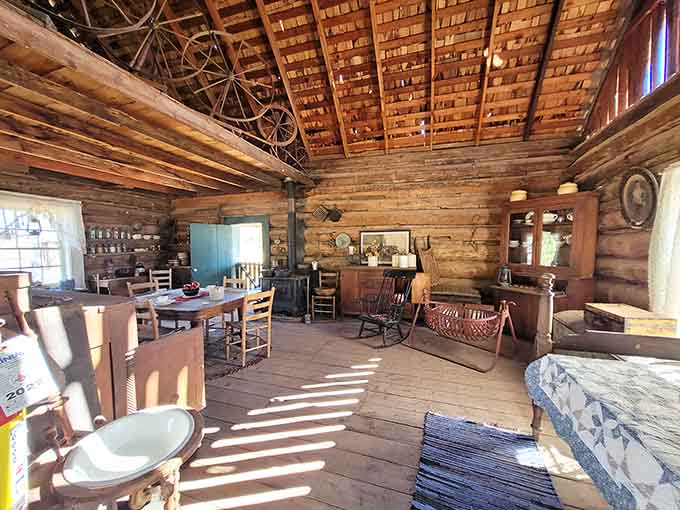 This weathered log cabin showcases the rustic reality of frontier living, where craftsmanship and determination created shelter from the desert elements.