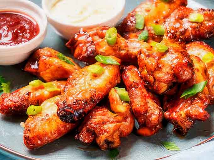 Glazed to glossy perfection, these saucy beauties glisten like edible jewels, ready to make your fingers delightfully messy.