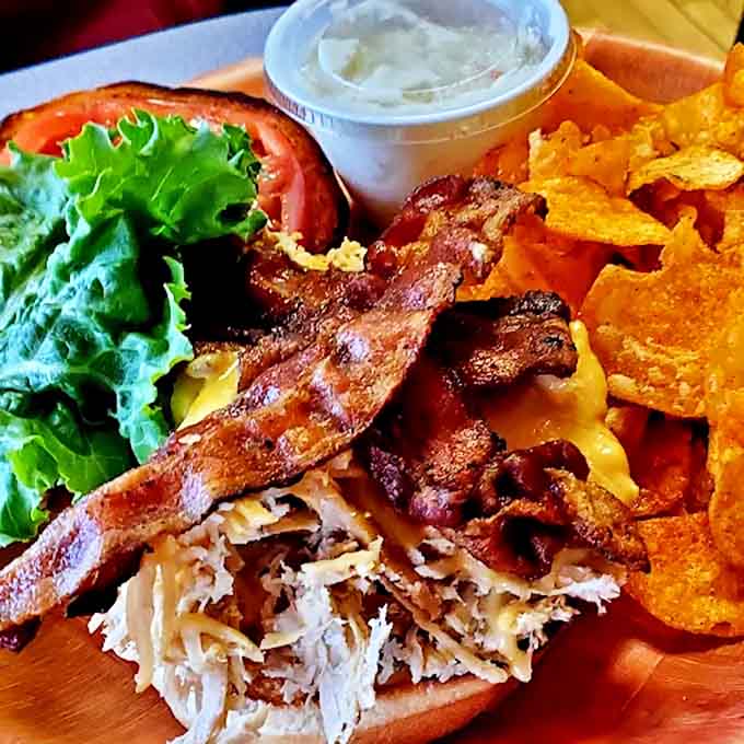 This isn't just a sandwich &ndash; it's architecture on bread! Crispy bacon, tender turkey, fresh lettuce, and juicy tomato create the perfect handheld masterpiece.