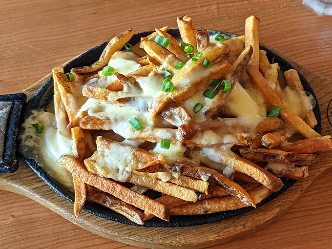 These aren't just any fries &ndash; they're hand-cut potatoes smothered in rich gravy and genuine cheese curds that squeak with each bite.