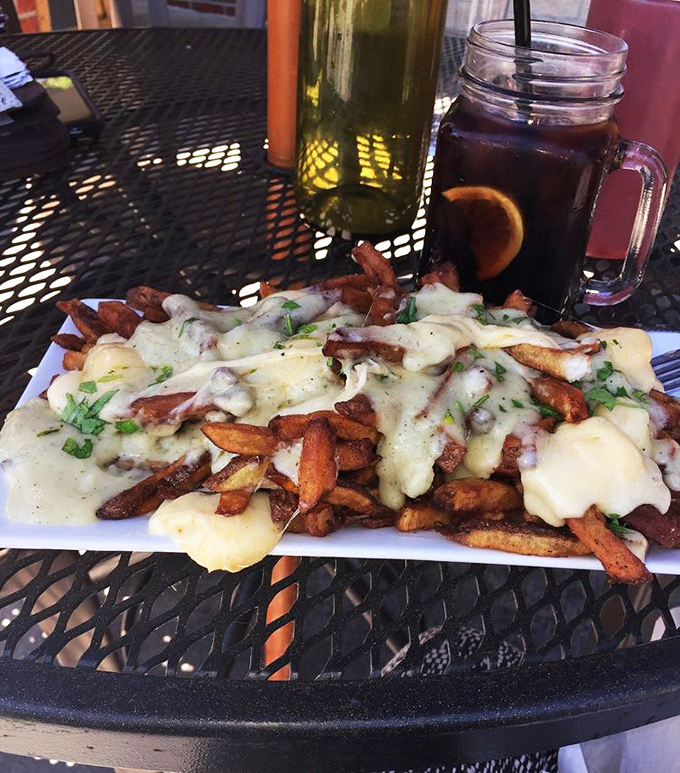 A mountain of golden fries drowning in melted cheese and rich gravy&mdash;this poutine is what comfort food dreams are made of.