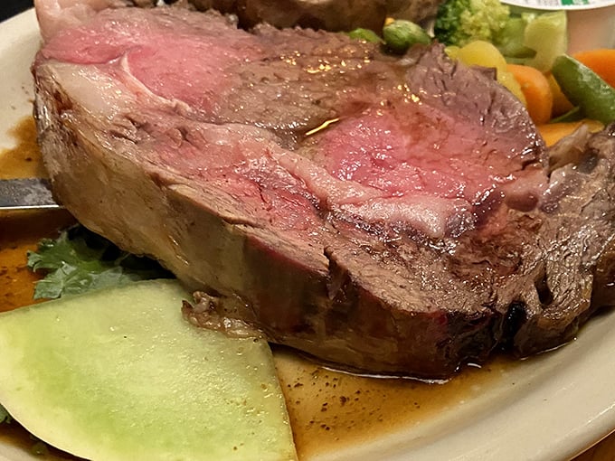 Prime rib so perfectly cooked it borders on poetry &ndash; tender, juicy, and seasoned to perfection with a side of fresh vegetables.