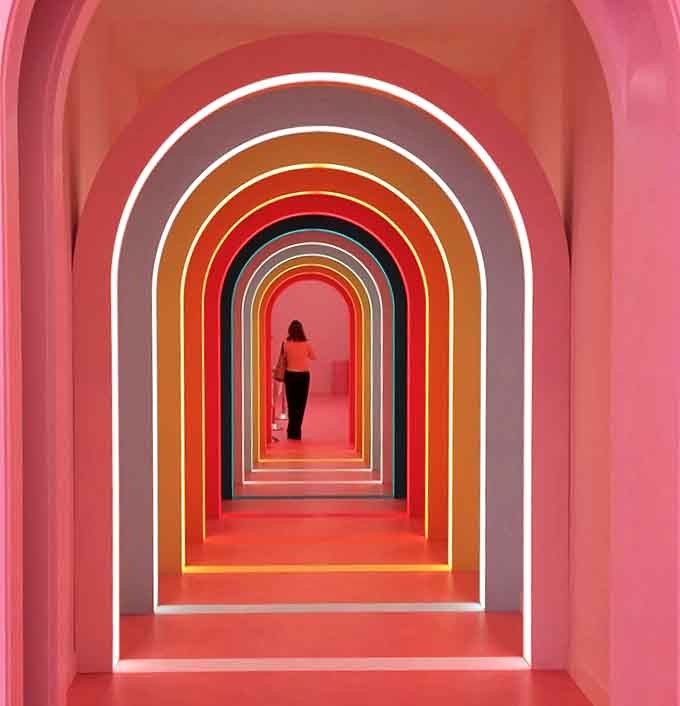 Step through nested rainbow arches that create an optical illusion of infinite color&mdash;a kaleidoscopic journey promising sweet rewards ahead.