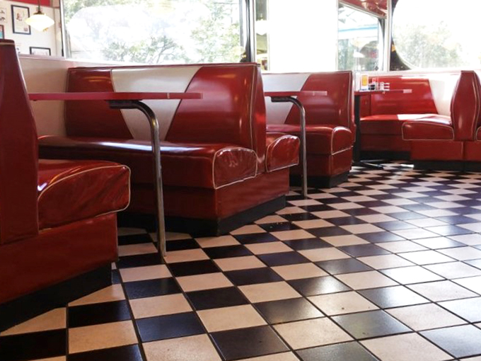 Red Booths and Checkered Tiles] Checkered floors and chrome galore! This diner's interior is so authentically retro, you'll be checking your phone for a flux capacitor.