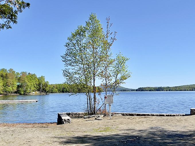 Crystal clear waters invite swimmers to take the plunge, while the surrounding mountains stand guard.