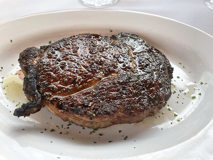 The star of the show arrives with a perfect sear, glistening with juices that promise a flavor explosion with every bite.