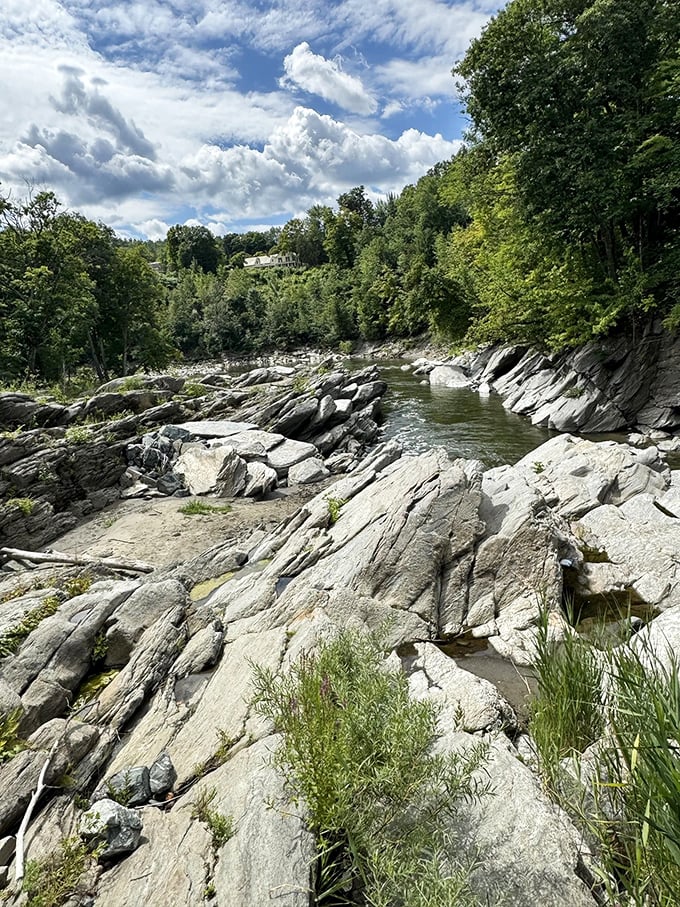 Smooth stone platforms carved by millennia of flowing water create nature's perfect lounging spots along the riverbed.