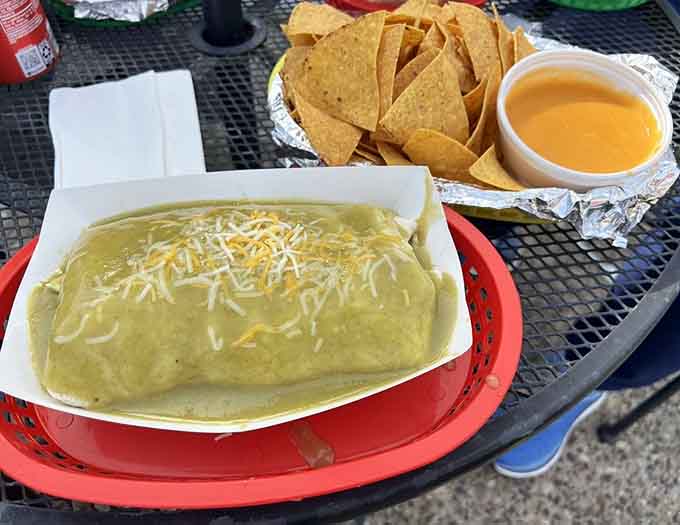 The Burrito Chile Verde, smothered in that tangy green sauce and melted cheese, looks like comfort food decided to throw a party.