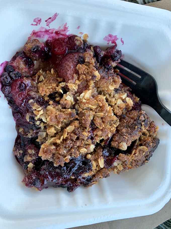 Strawberry rhubarb pie that's achieved legendary status, one perfect slice of sweet-tart heaven topped with golden crumble perfection.