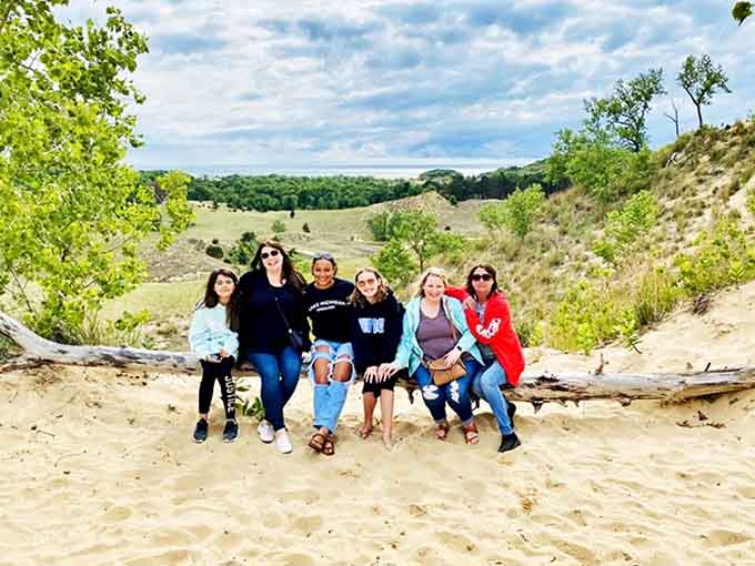 Nothing says "we're about to have the time of our lives" quite like a group photo on the dunes, where the smiles are as genuine as the landscape is breathtaking.
