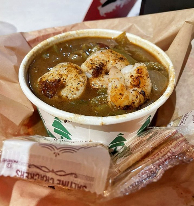 This seafood gumbo isn't just a soup—it's a spiritual experience. Those plump shrimp floating in that dark, rich roux are practically winking at you.