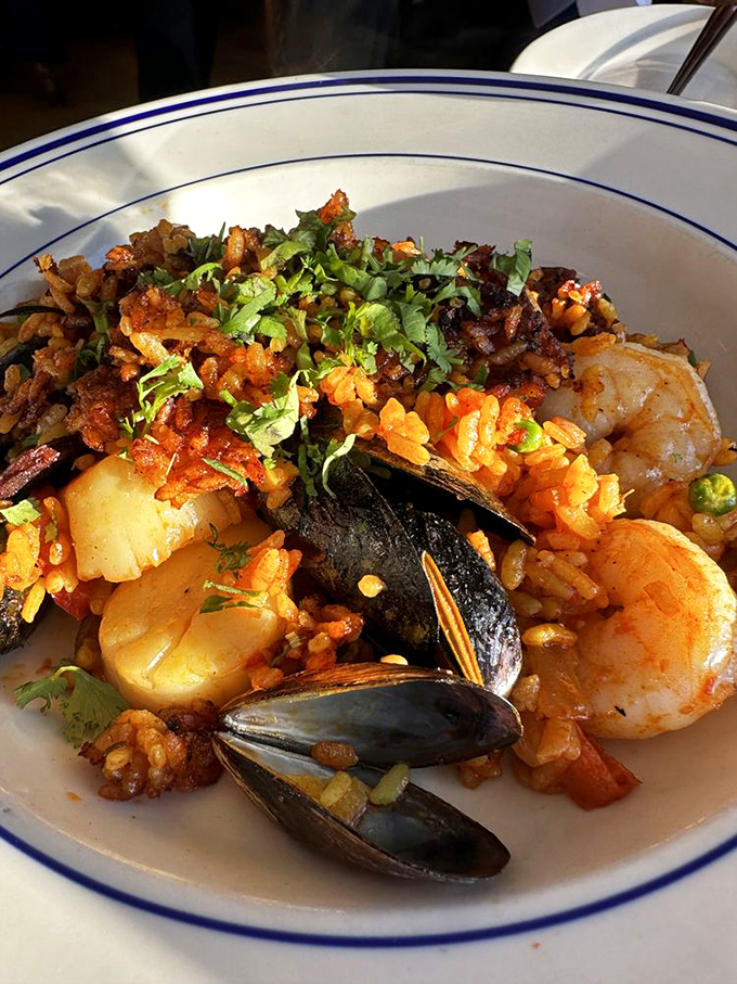Their legendary seafood paella arrives like buried treasure&mdash;golden rice cradling lobster, mussels, and shrimp fresh from Maine waters.