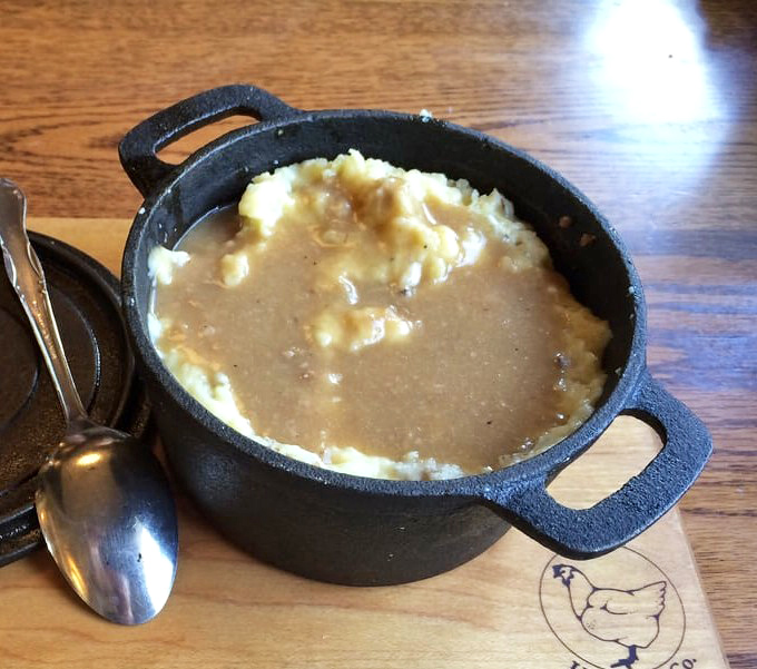 The shepherd&rsquo;s pie arrives bubbling hot, topped with creamy mashed potatoes and drenched in rich, savory gravy.