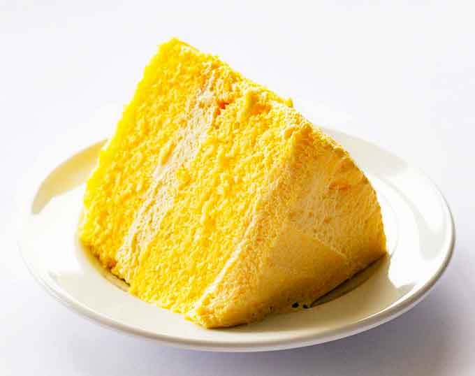 One slice reveals the impossibly airy interior – like biting into a lemon-scented cloud that somehow manages to be substantial and ethereal simultaneously.