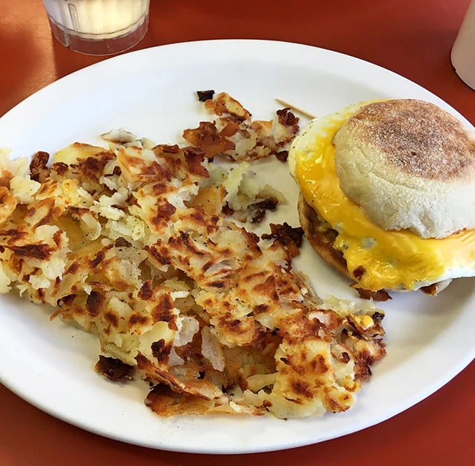 Those legendary hash browns spread across the plate like crispy golden treasure, achieving the perfect texture that makes them worth the trip alone.