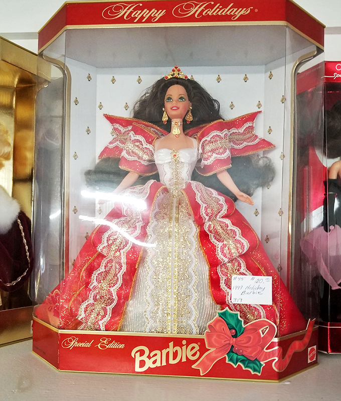 Holiday Barbie stands sentinel in her original packaging. She's seen thirty Christmas seasons come and go, yet remains eternally ready for the ball.