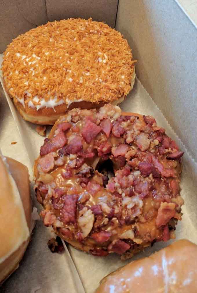 Behold the maple bacon masterpiece: crispy bacon bits meet sweet maple glaze on a fluffy potato flour cloud of happiness.