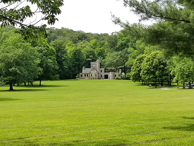 The manicured lawn surrounding the castle proves that even mysterious Gothic structures appreciate good landscaping and a well-maintained yard.