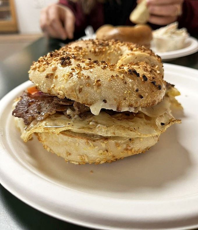 Steak, egg and cheese breakfast sandwich: Breakfast nirvana on an everything bagel – layers of savory steak, melty cheese, and perfectly cooked egg create morning magic.