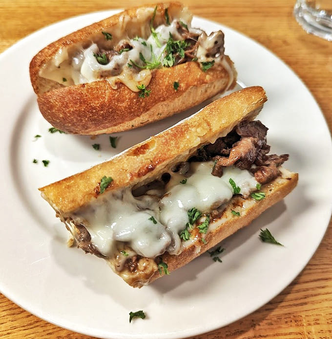 Behold the steak sandwich in all its melted provolone glory, topped with mushrooms and garlic aioli that'll make you question every other sandwich you've ever called good.