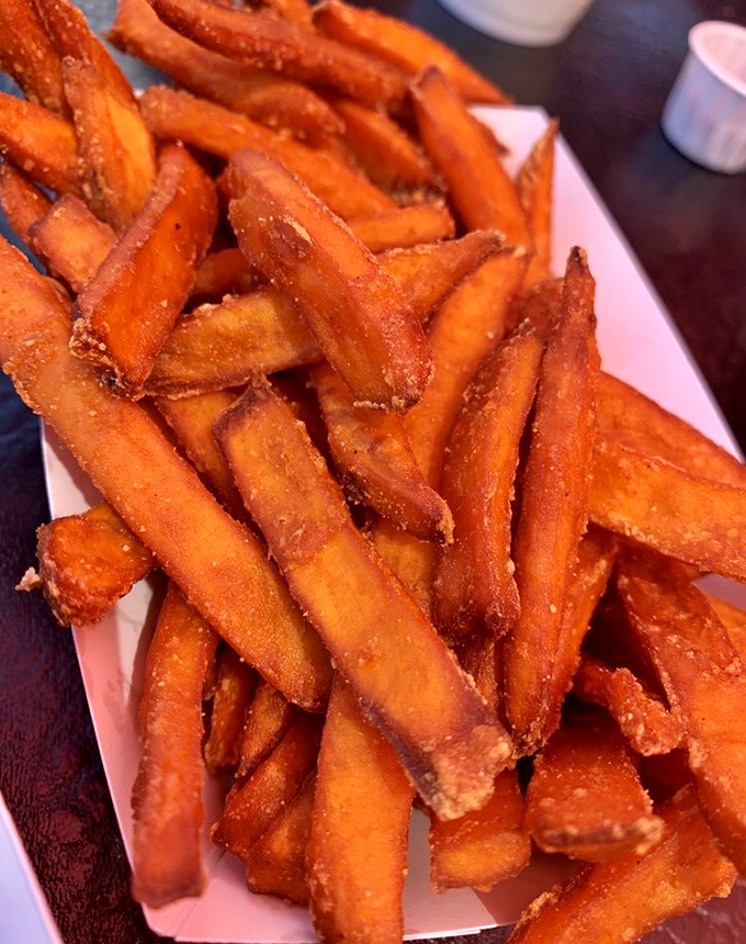 These aren't ordinary sweet potato fries &ndash; they're crispy-outside, tender-inside orange masterpieces that have developed their own cult following.