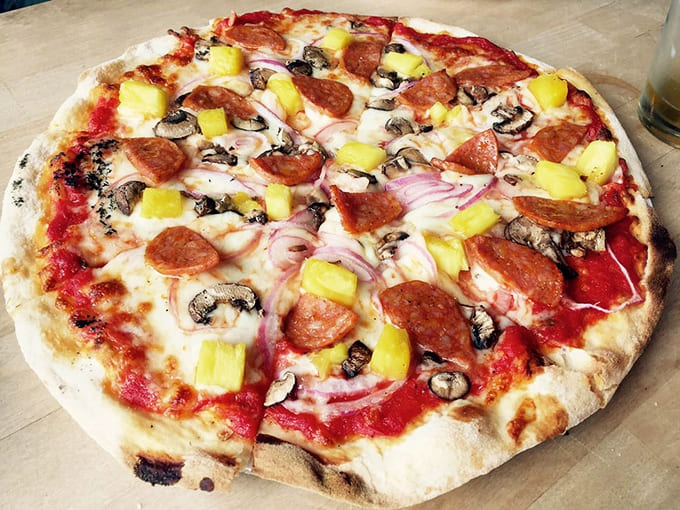 The Kilauea pizza brings the heat with pepperoni, mushrooms, and banana peppers creating a flavor explosion worthy of its volcanic name.