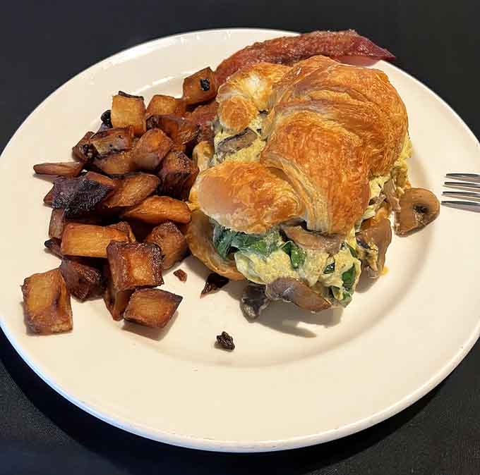 Behold the croissant sandwich, where flaky buttery layers meet savory breakfast fillings in a union that makes perfect sense.