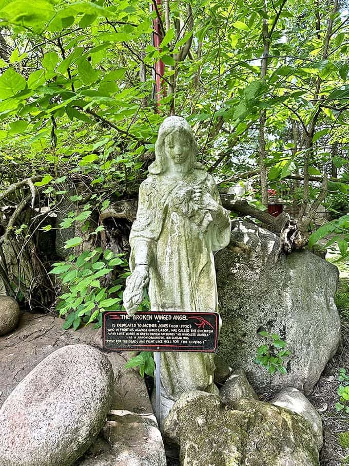 The Broken Winged Angel stands as a silent sentinel, her weathered face and damaged wings somehow more beautiful for their imperfections.