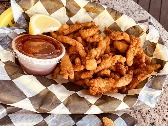 Golden, crispy, and calling your name, these clam strips achieve that magical crunch that sounds like happiness with every bite you take.