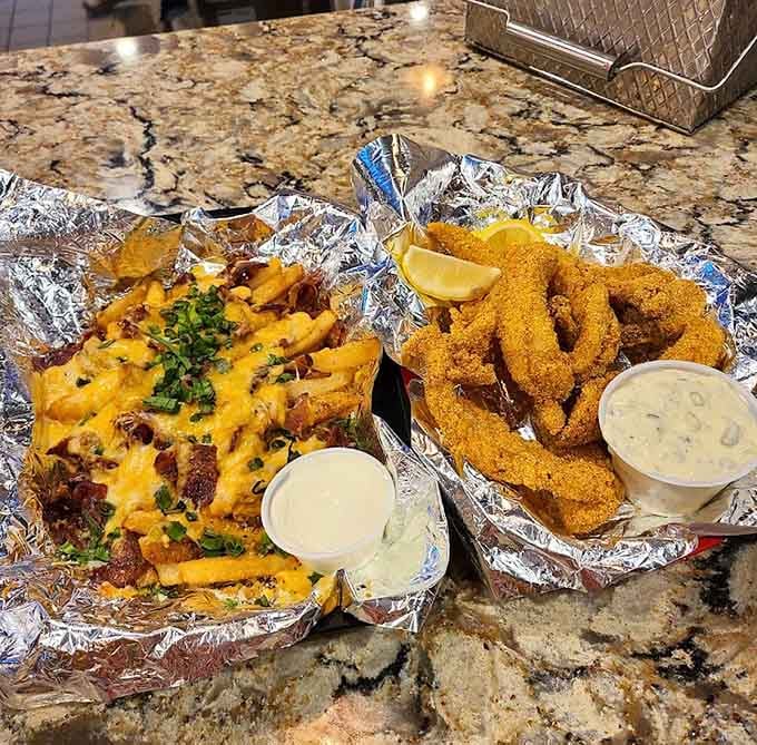 Golden walleye fingers and loaded fries prove that sometimes the best meals come wrapped in foil and served without pretension.
