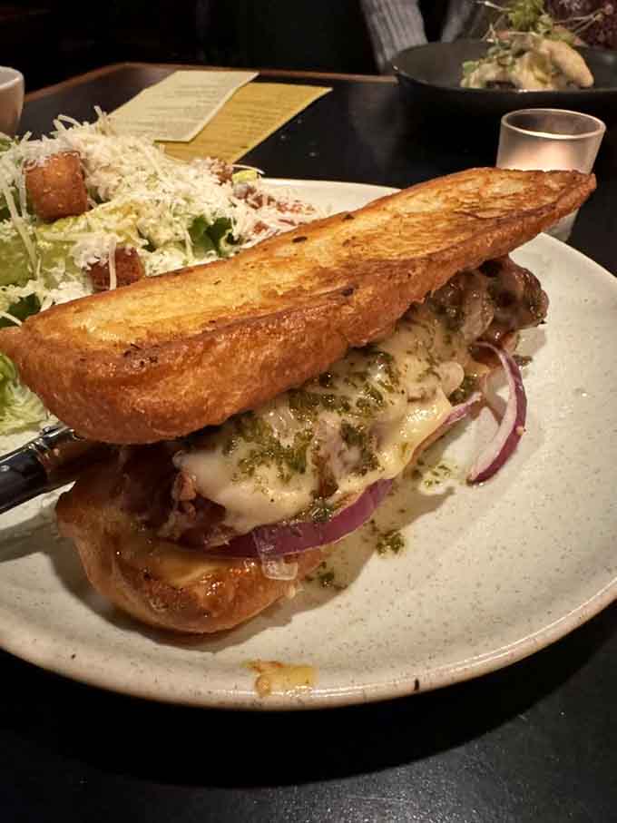 Behold the Cuban that launched a thousand return visits, pressed ciabatta barely containing pulled pork, ham, and those genius brandied onions.