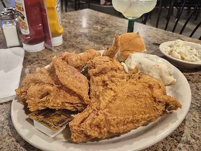 This is what fried chicken dreams are made of: golden, crispy, and so perfectly cooked you can practically hear the crunch through the photo.
