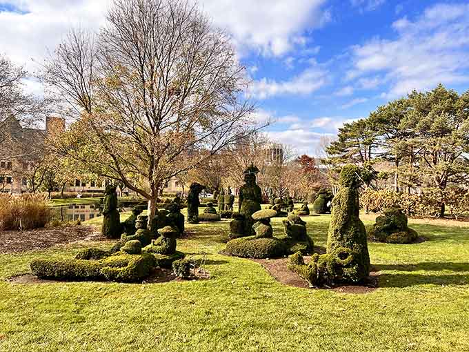 These topiary figures stand like silent green sentinels, patiently waiting for someone to appreciate their commitment to staying perfectly still.