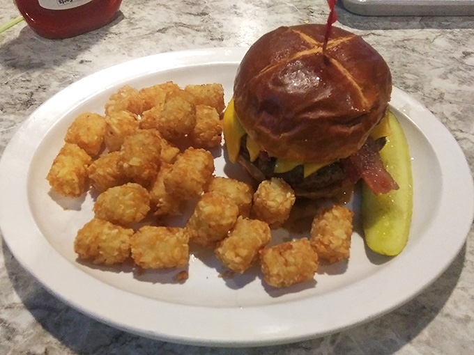 This burger with golden tater tots showcases exactly why people drive from across the region for Topper's creations.