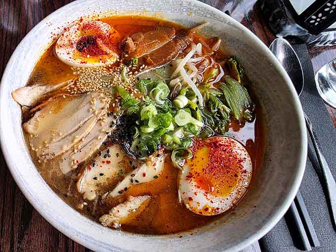 The Korean ramen arrives like a work of art, with perfectly poached eggs and vibrant toppings that make you pause before diving in, camera first.