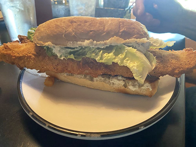 Behold the star of the show: golden, crispy walleye perfection nestled in a toasted bun.