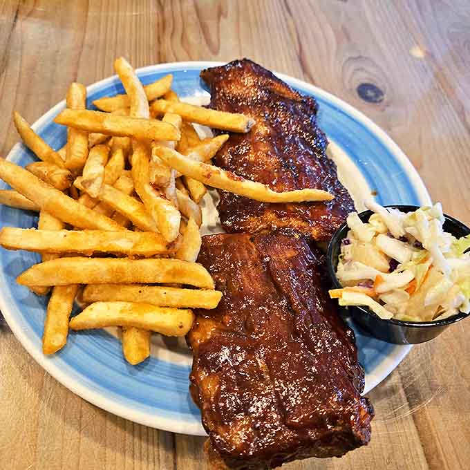 Fall-off-the-bone tender and glistening with sauce, these ribs might make you forget you're in a seafood restaurant. Served with crispy fries and creamy coleslaw for the perfect plate.
