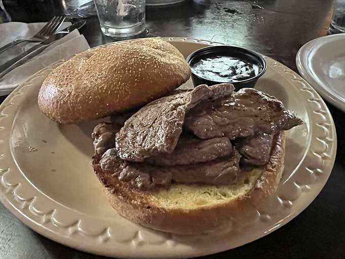 The sandwich that launches a thousand dreams – tender, perfectly seasoned venison on a grilled bun that somehow contains all that juicy goodness.