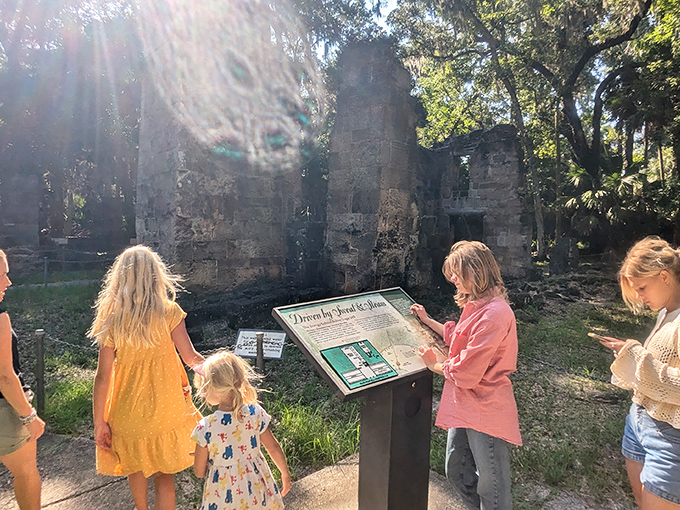 History hunters in their natural habitat! Curious explorers discover the stories hidden within these ancient coquina walls.