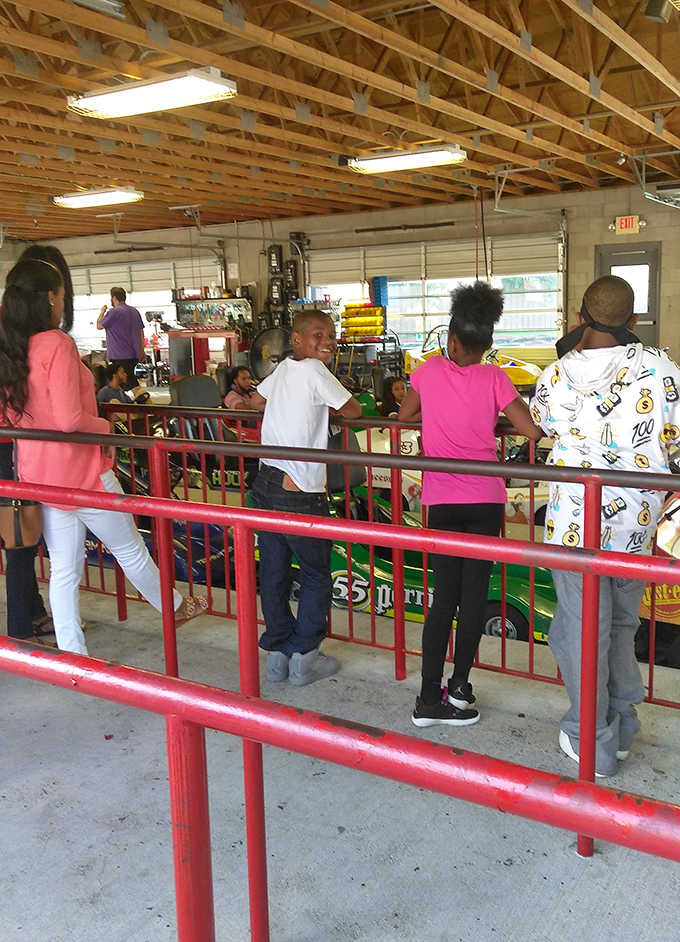 Excitement builds as young guests queue up for their next adventure, the industrial-chic interior creating a perfect backdrop for memory-making.