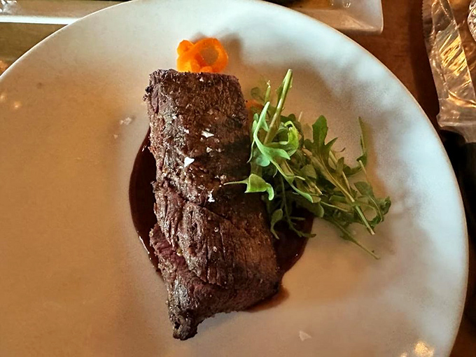 This isn't just a steak; it's a masterclass in restraint. Perfect sear, minimal garnish, and a sauce that knows its supporting role.