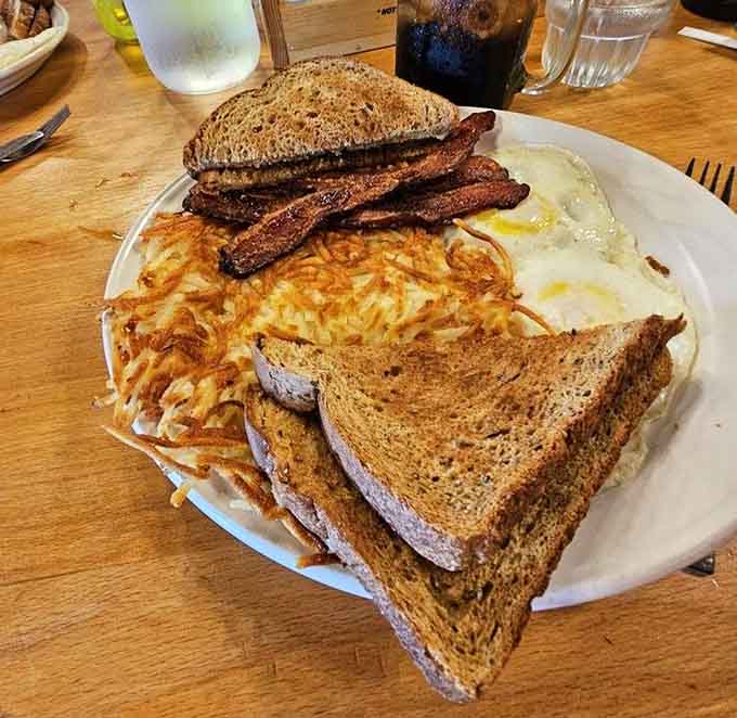 Breakfast done right means crispy bacon, perfectly cooked eggs, golden hash browns, and toast&mdash;simple pleasures executed to perfection.