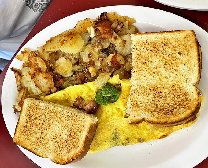 A Western omelette that's all business, paired with those famous home fries that achieve the perfect balance of crispy exterior and fluffy interior.
