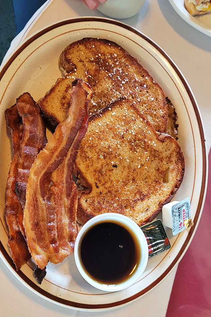 Golden French toast and perfectly crisp bacon &ndash; breakfast comfort that makes you want to linger over another cup of their robust coffee.